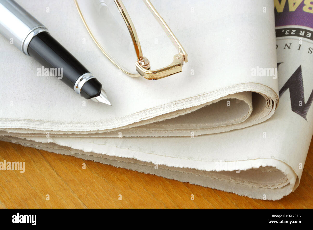 Newspaper Glasses Pen on Desk Stock Photo - Alamy