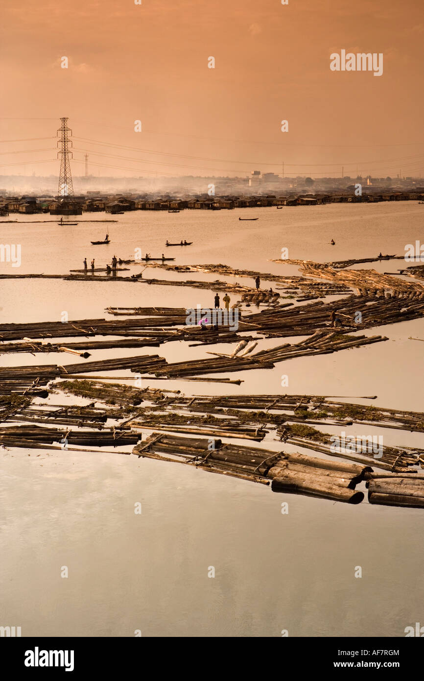 Nigeria Lagos Wooden logs in water for construction Stock Photo - Alamy
