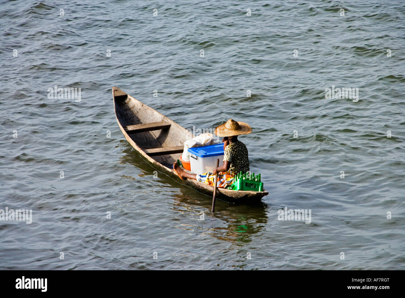 Nigeria Lagos Woman sitting on canoe in lagoon Stock Photo - Alamy