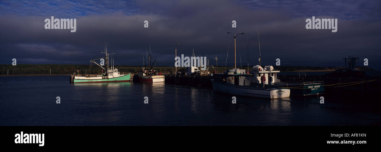 Panorama fishing boats dark sky Stock Photo - Alamy