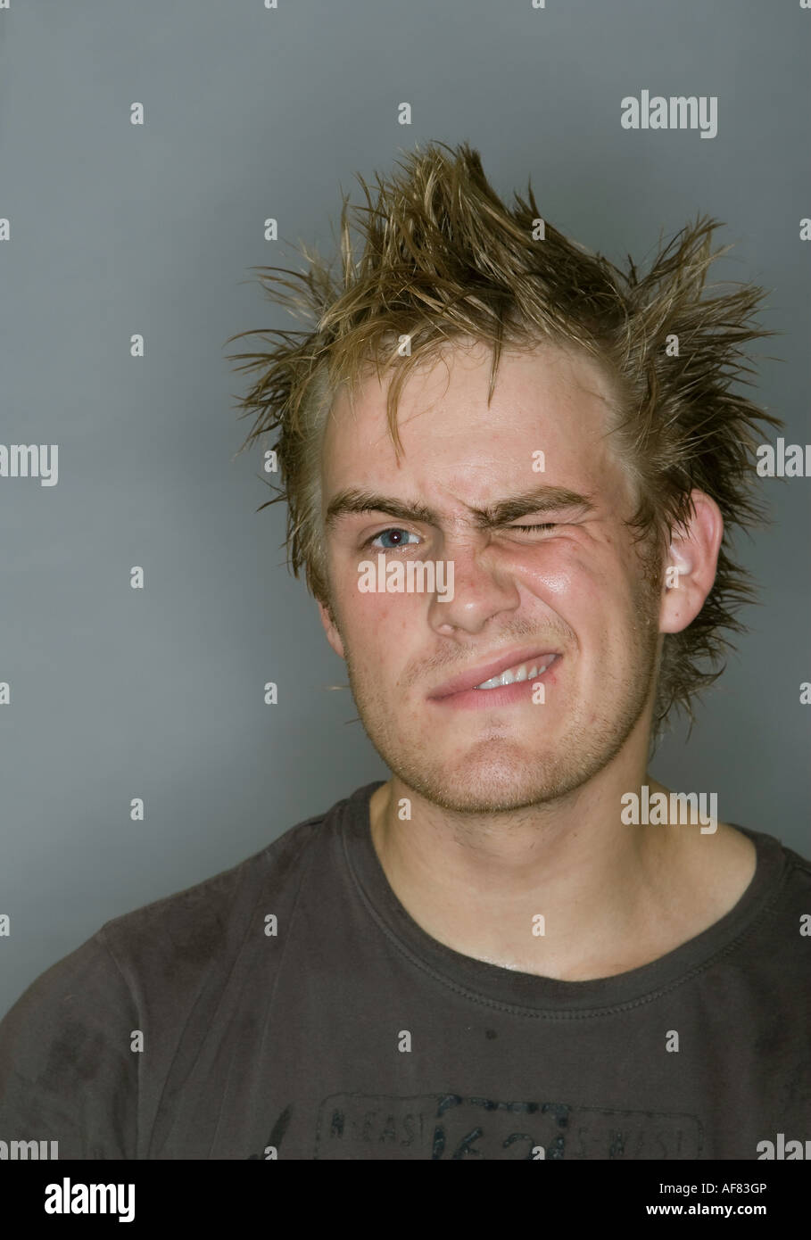 cute handsome scruffy caucasion young adult winking the eye Stock Photo ...