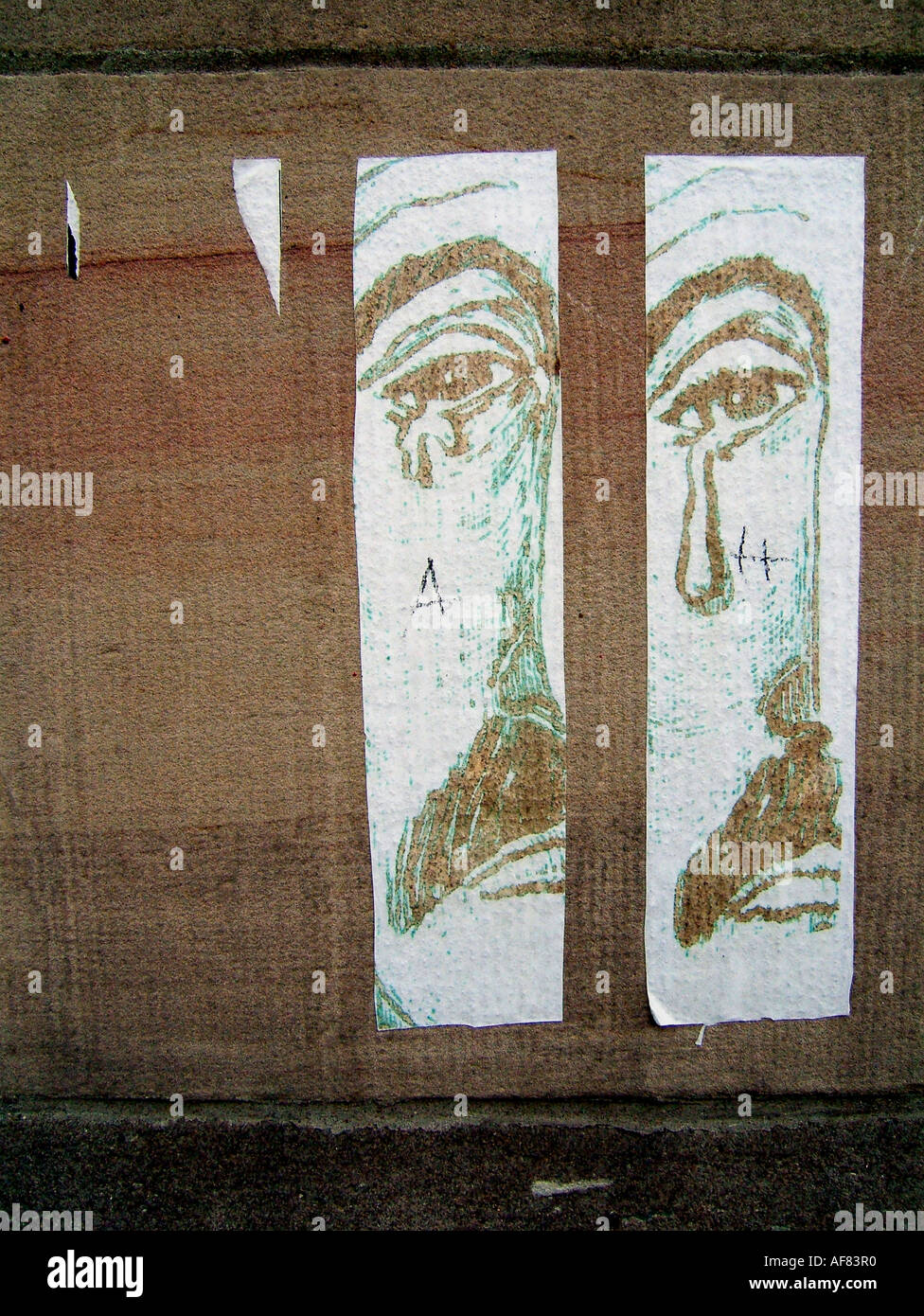 torn poster on concrete wall Stock Photo - Alamy