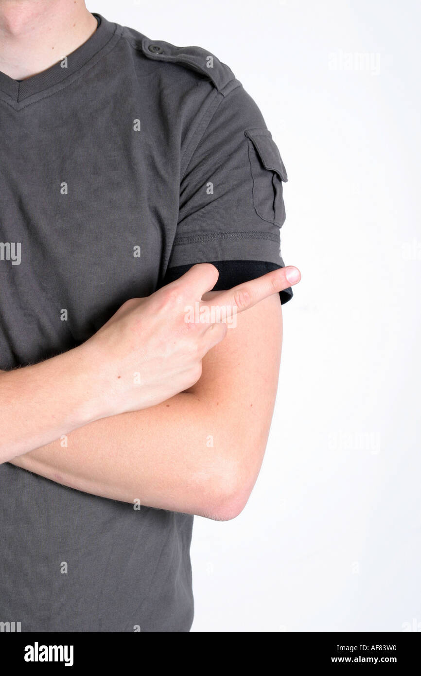 A Stock Photograph of a Male with His Arms Crossed and Sending a ...