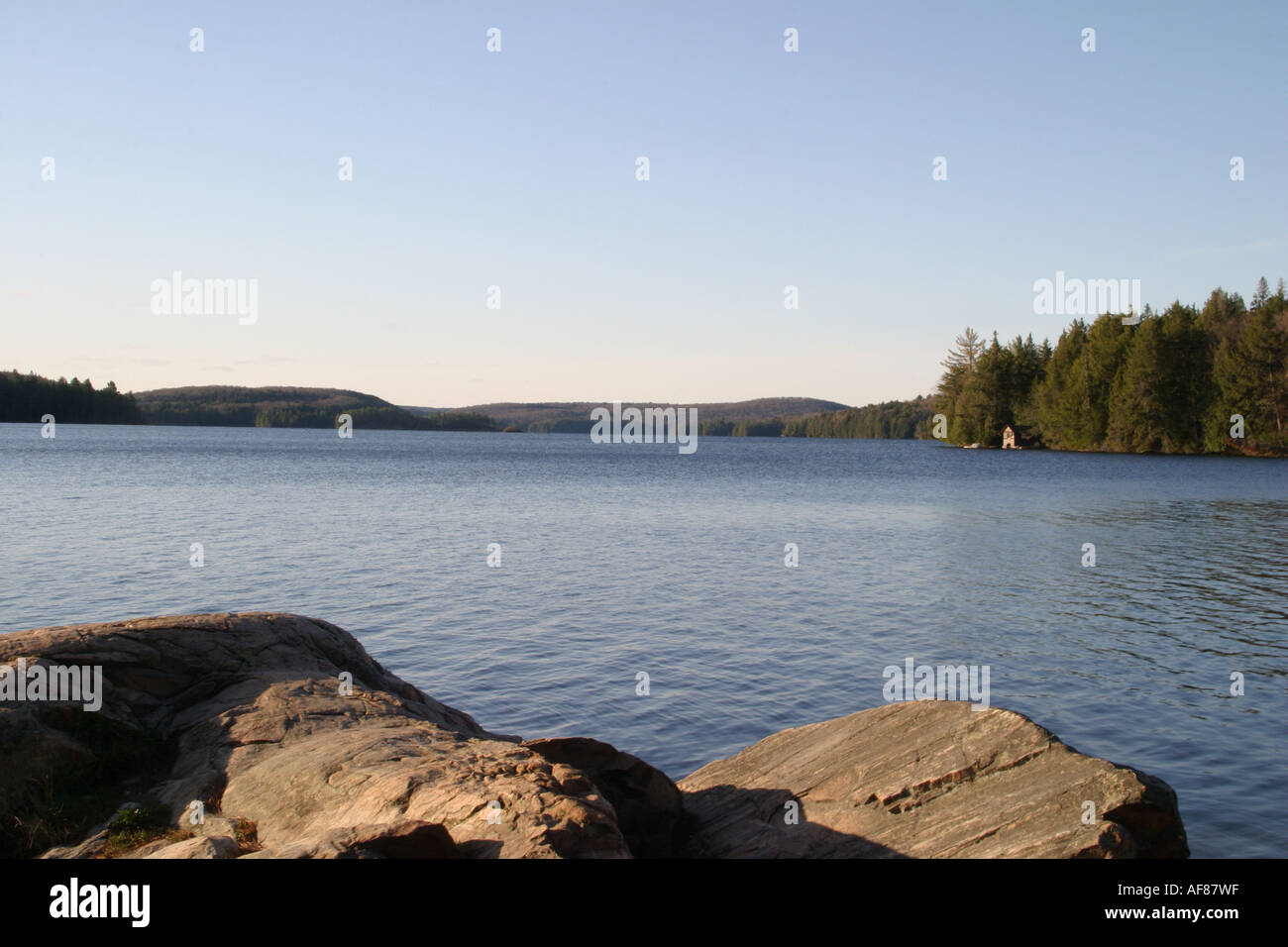 Lake view and stones 2 Stock Photo - Alamy