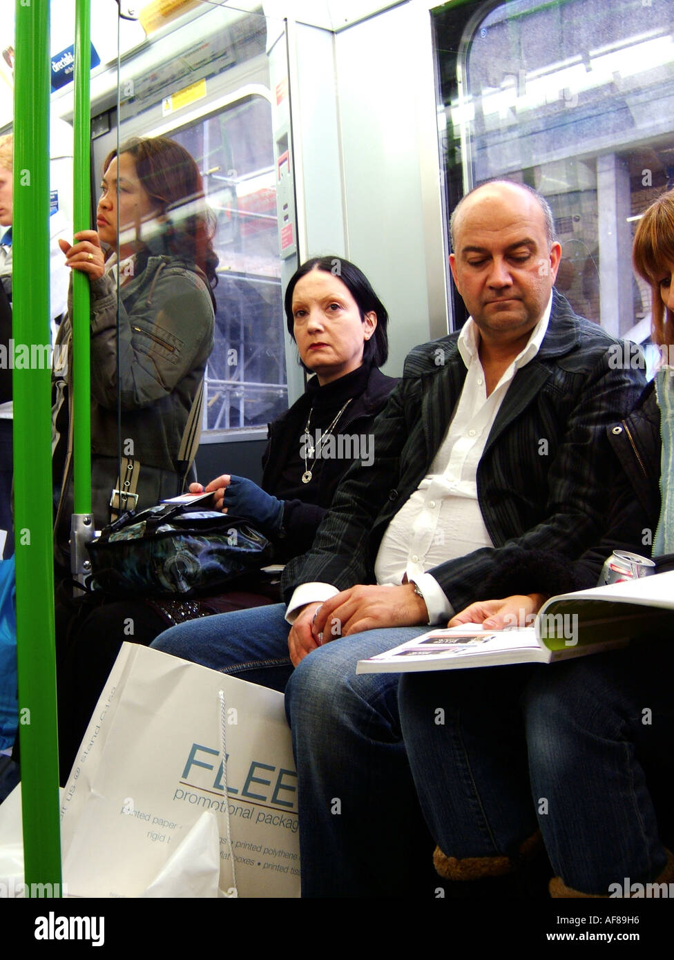 travellers on London Underground Stock Photo - Alamy