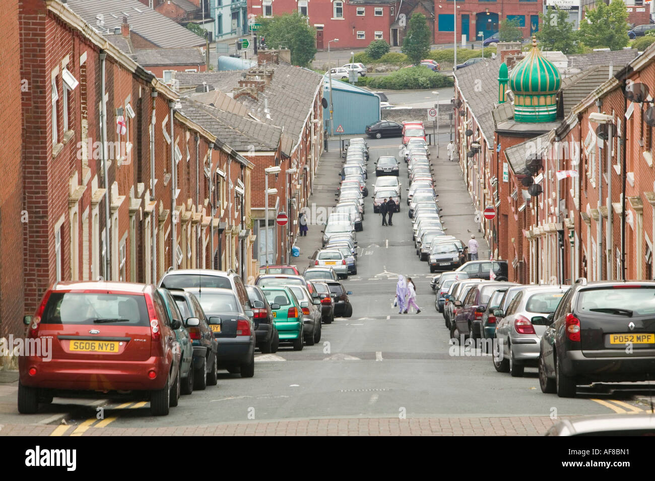 a muslim street in blackburn lancashire, UK, with mosque Stock Photo ...