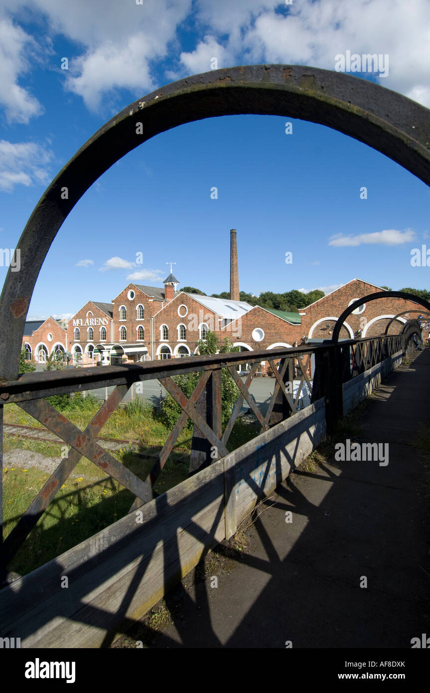 former railway buildings and old rusty cast iron footbridge Oswestry ...