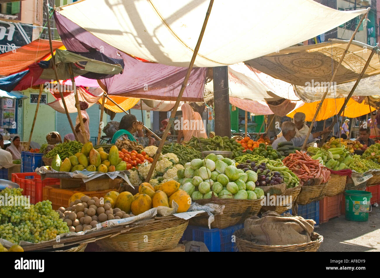 Horizontal close up of a typical busy Indian fruit and vegetable market ...
