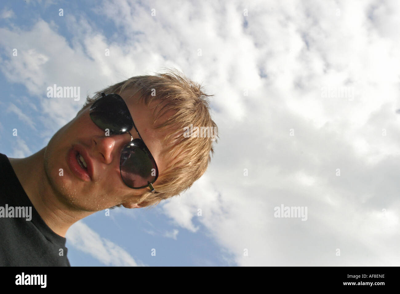 A Stock Photograph of a Student in the Summer Sun with Sunglasses on ...