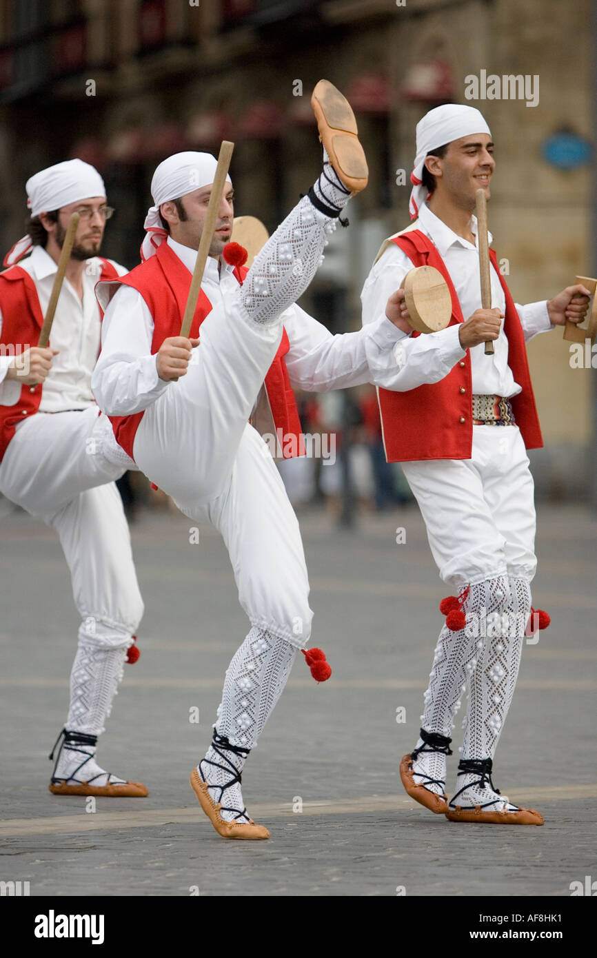 Men kicking legs in air during Basque folk dancing Plaza Arriaga Stock ...