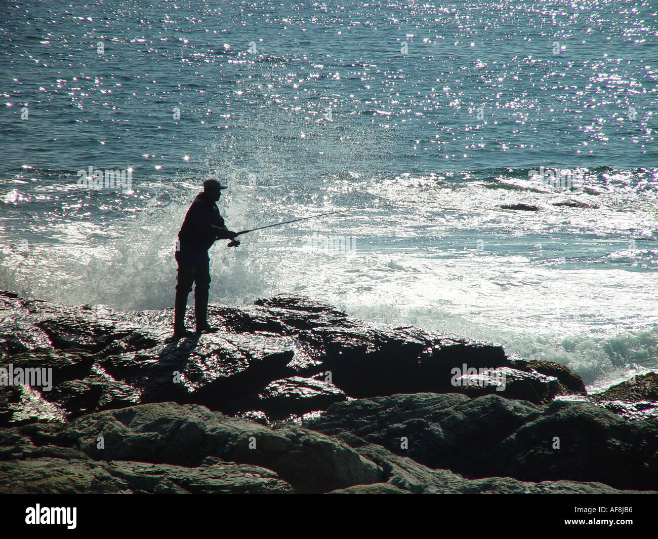 Fishermen fishing from rocks hi-res stock photography and images - Alamy