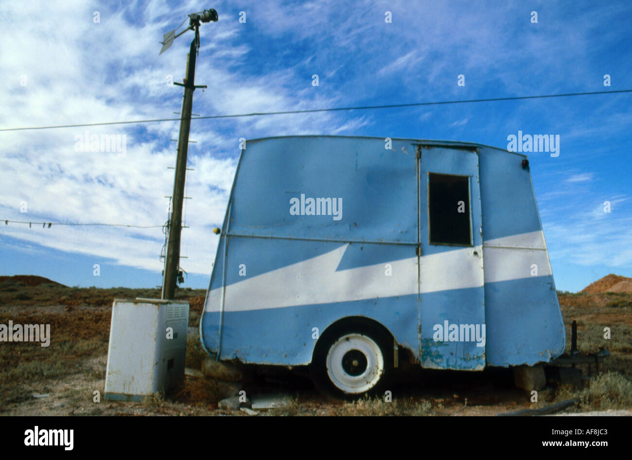 Solitary pale blue caravan Stock Photo - Alamy