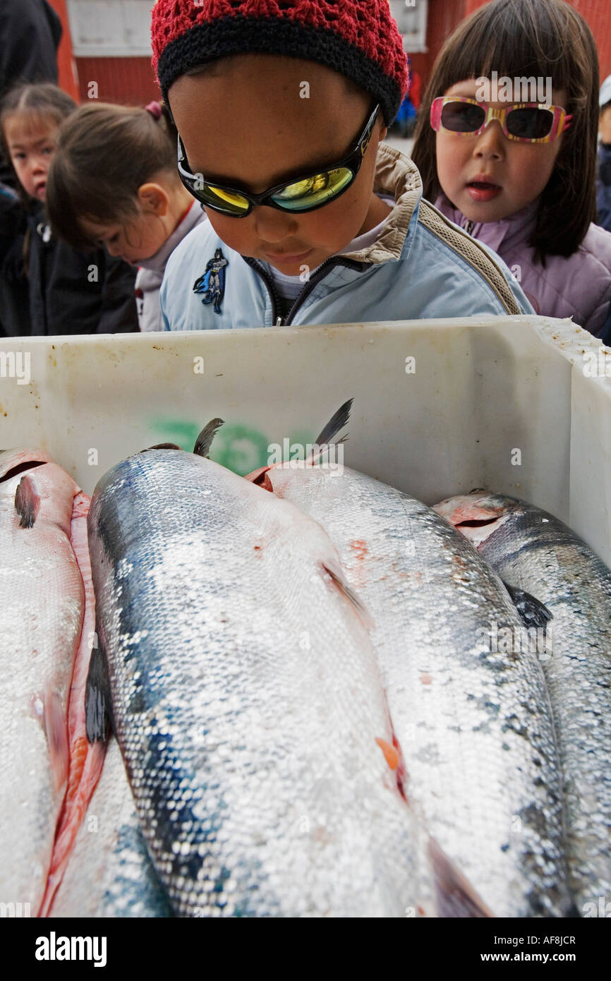 Inuit, Eskimo children whatch the fishdisplay at the fish, and ...