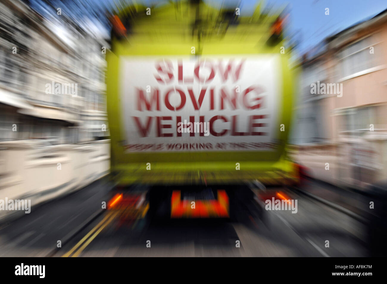 A Slow moving Vehicle sign on the tailgate of a Brighton and Hove City ...