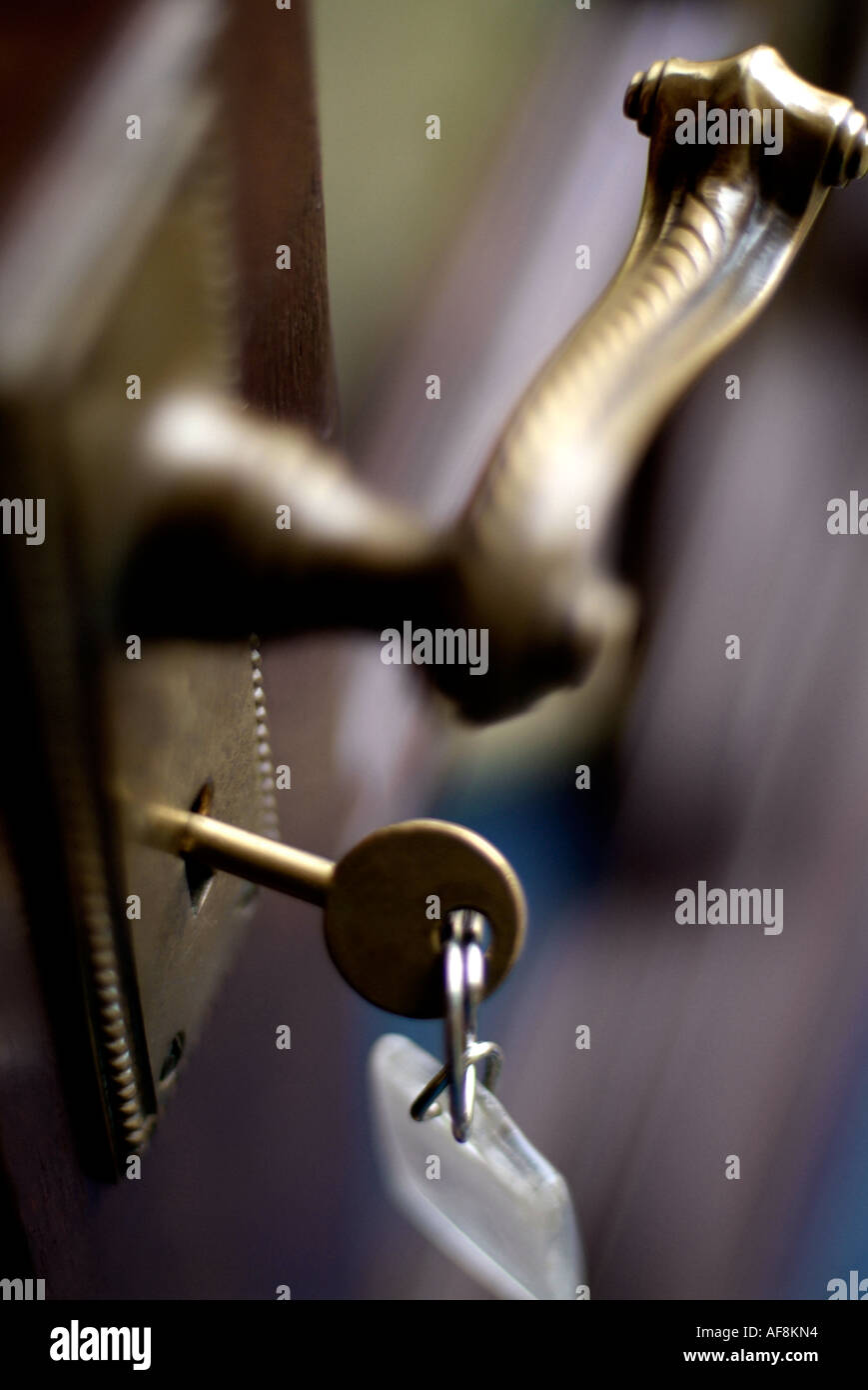 brass door handle and key Stock Photo - Alamy