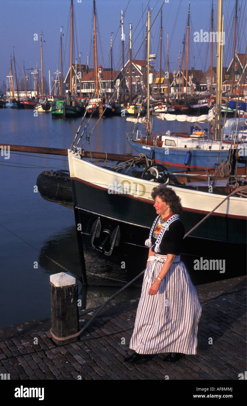 Netherlands Volendam Mature woman in traditional dress standing by ...