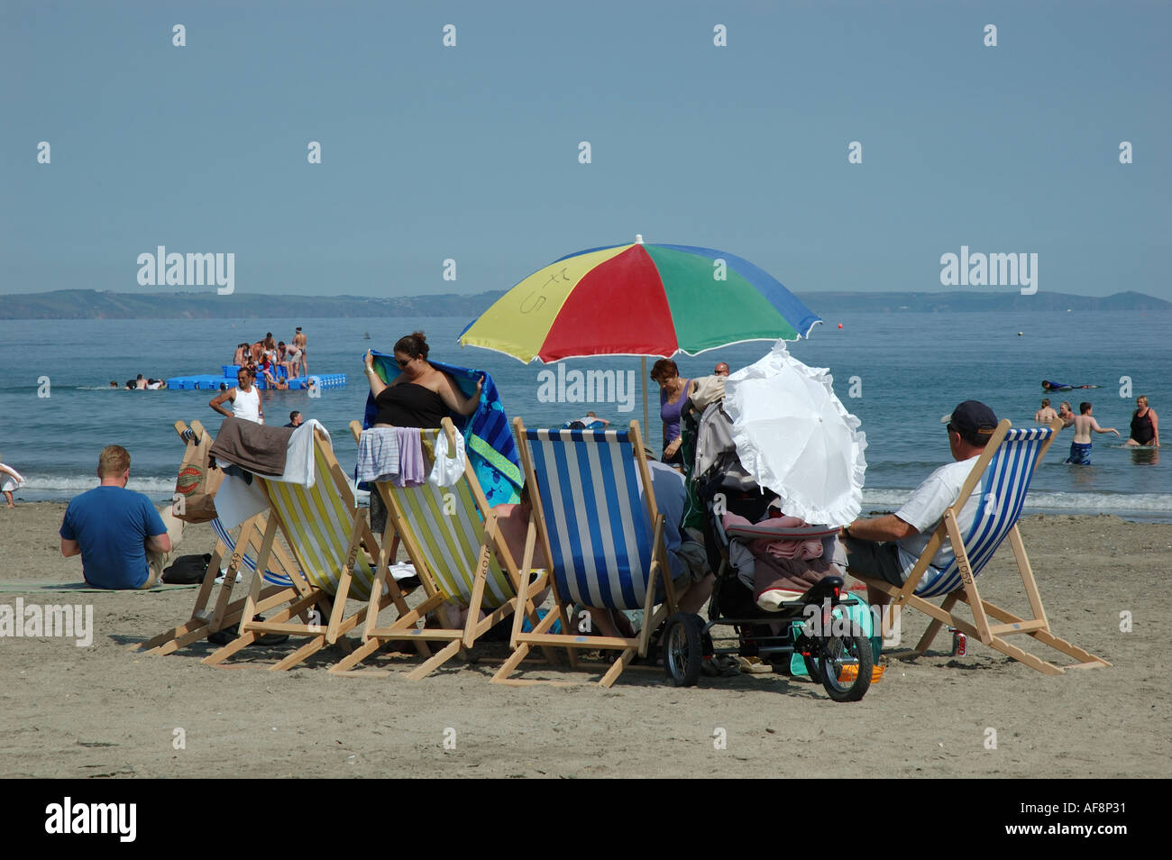 Group sunbathing on beach cornwall hi-res stock photography and images ...