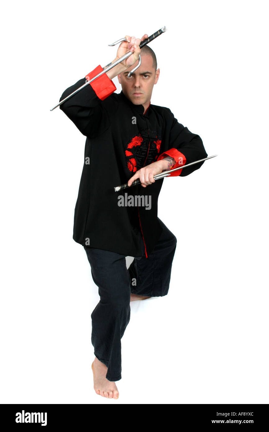 A Kung Fu master with two daggers Stock Photo - Alamy