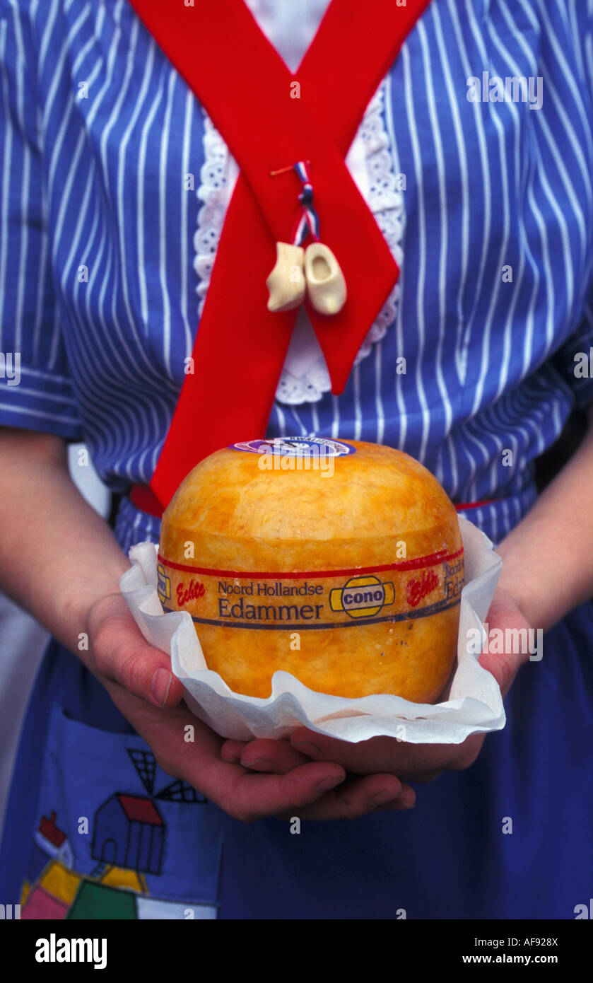 Netherlands Edam Girl in traditional clothing holding Edammer cheese ...