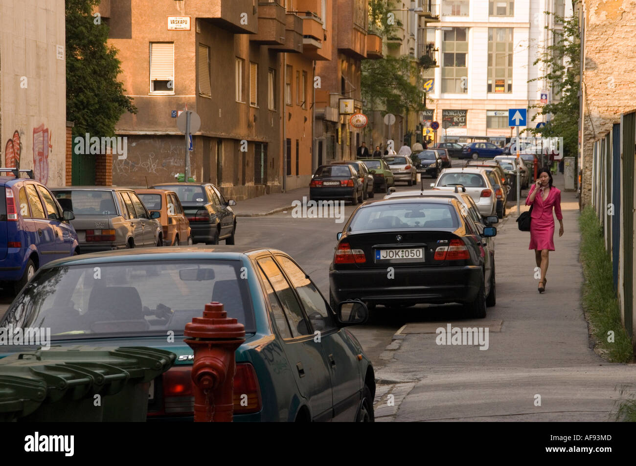 Women in Red walking, Street Scene in the busy streets of Budapest ...