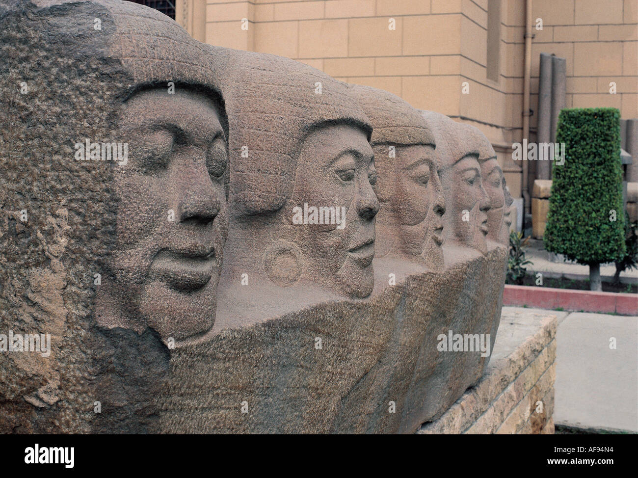 A stone carving depicting the heads of five slaves of Ramesses II in ...