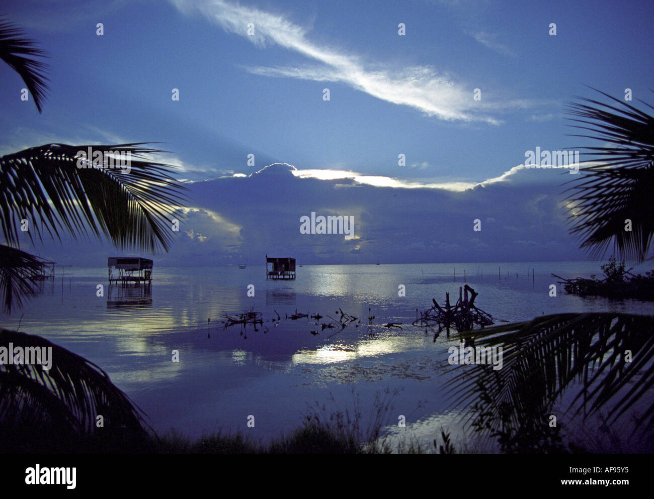 CAYE CAULKER BELIZE CENTRAL AMERICA August The sun sets over the calm ...