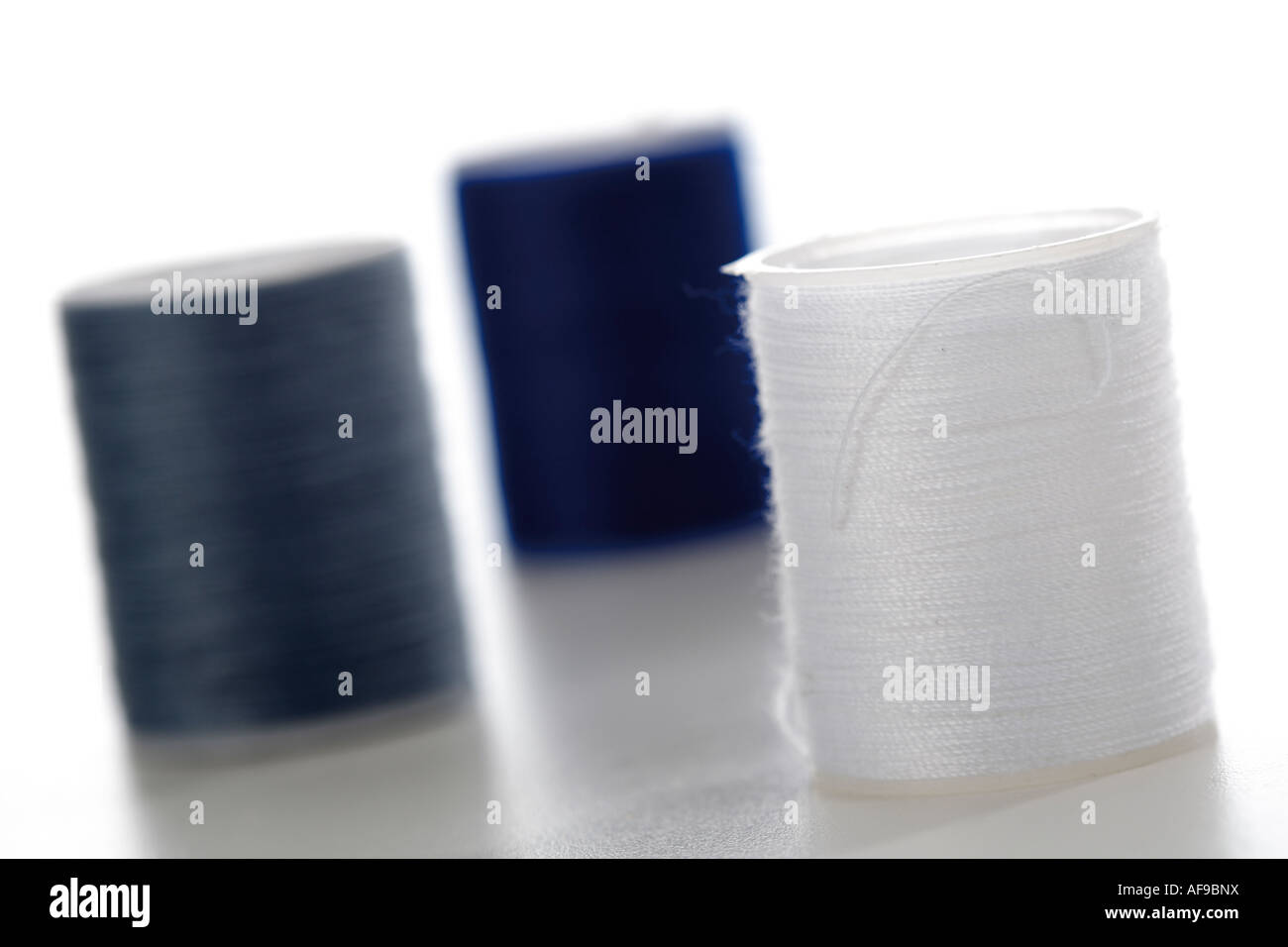 Three spools of thread, close-up Stock Photo - Alamy