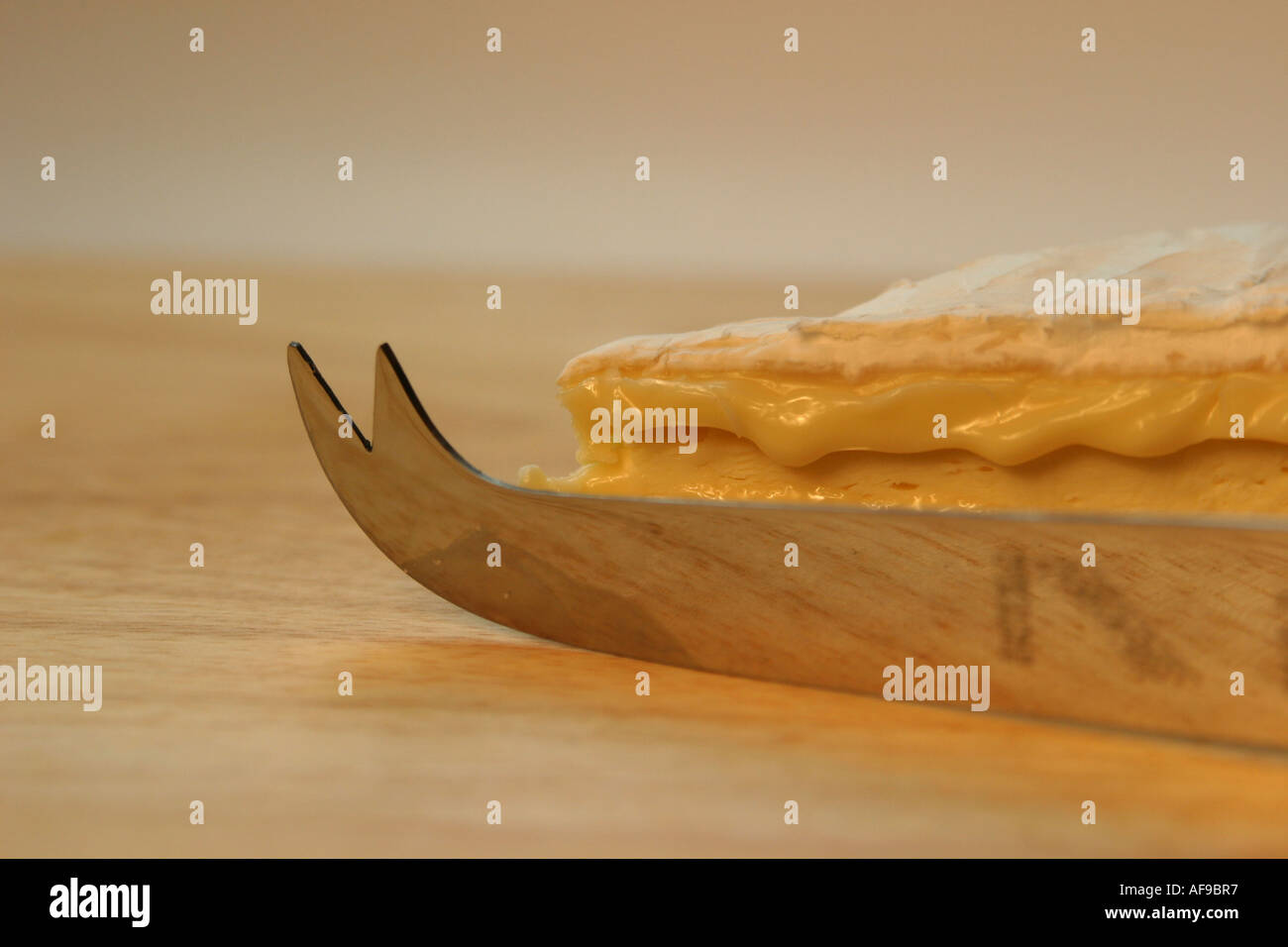 A Stock Photograph of Cheese Knife Cutting Brie Stock Photo - Alamy