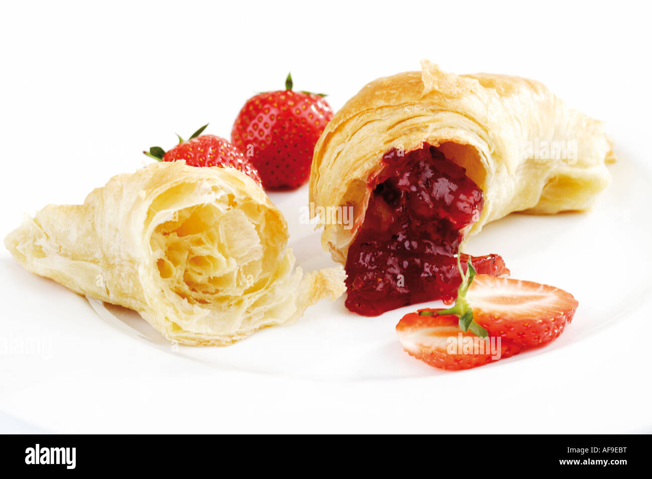 Croissant filled with strawberry jam Stock Photo - Alamy
