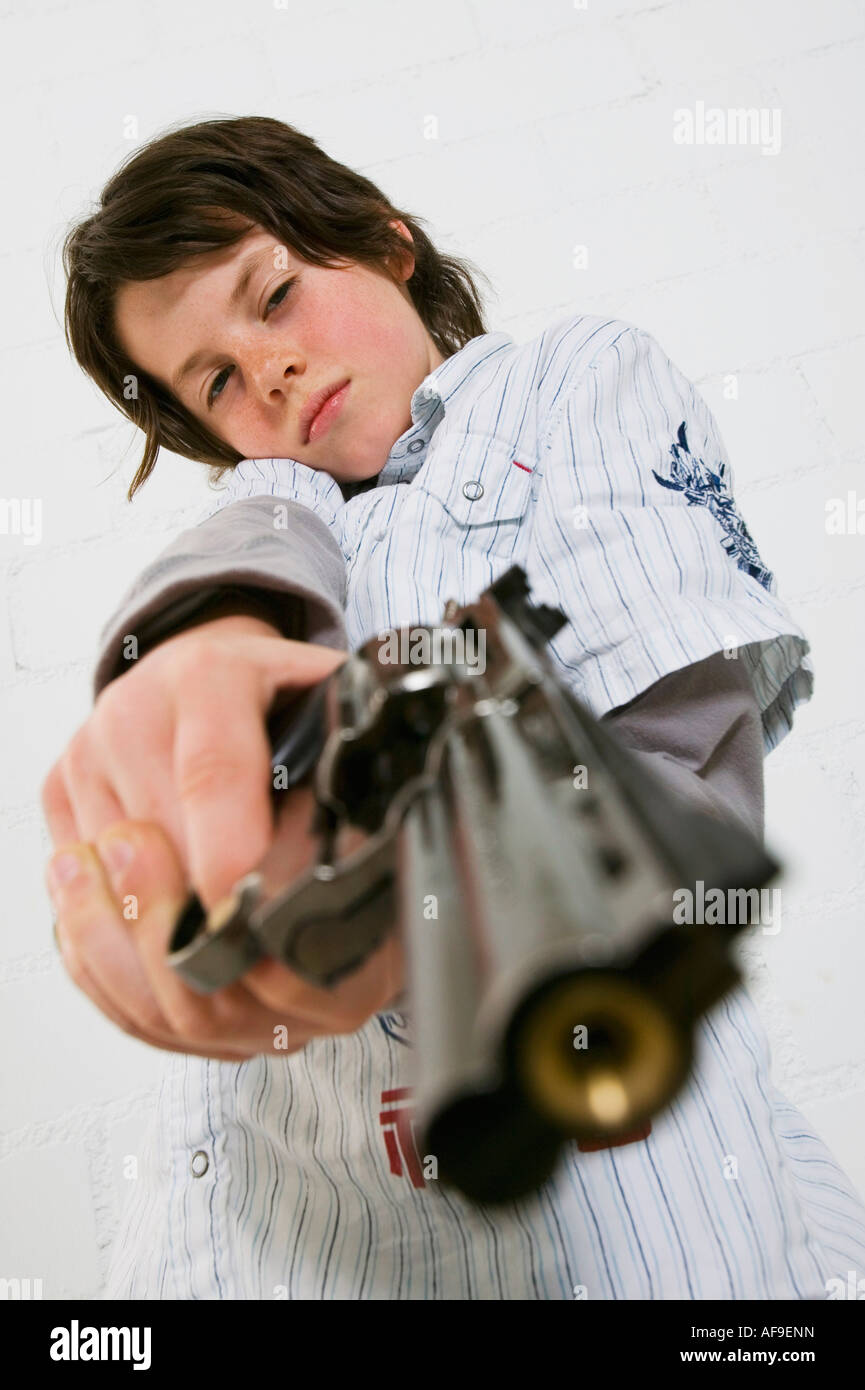 Boy holding gun hi-res stock photography and images - Alamy