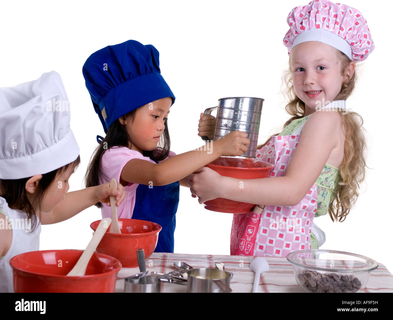 Young children cooking in the kitchen Stock Photo - Alamy