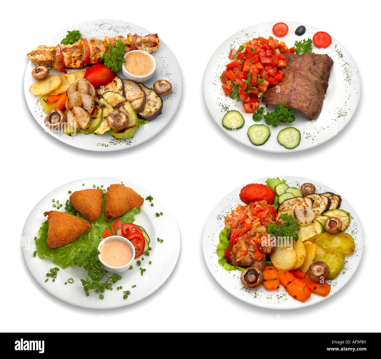 4 dishes of grilled meat and vegetables Stock Photo - Alamy