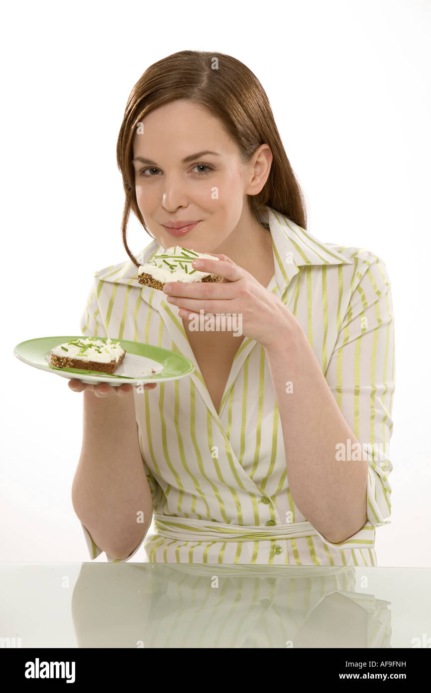 Woman eating bread, portrait Stock Photo - Alamy