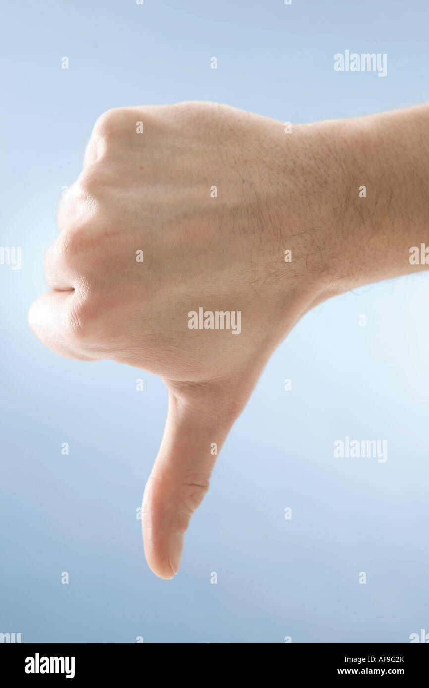Hand gesture, thumbs down, close-up Stock Photo - Alamy