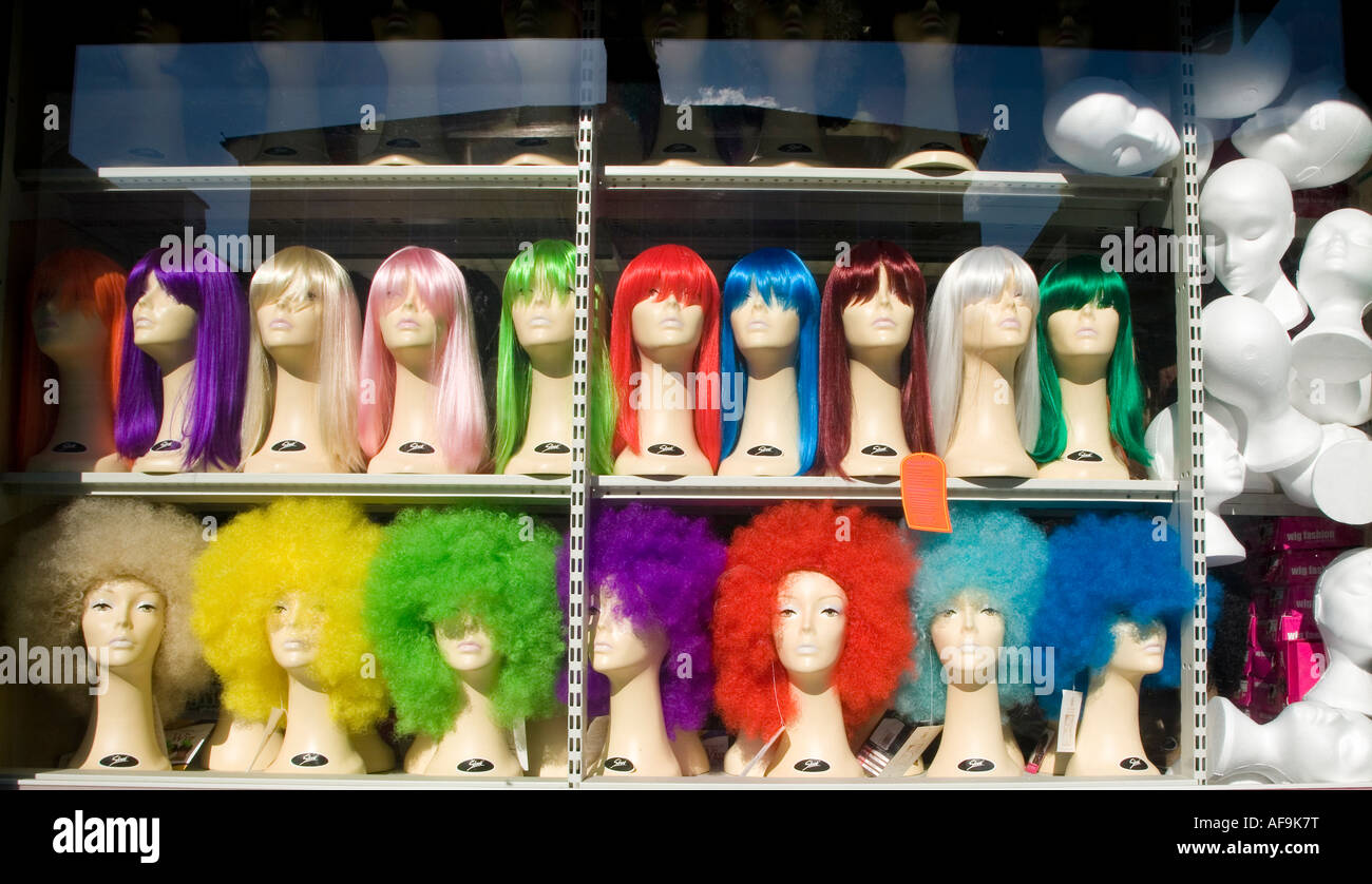 a display of elaborate wigs in a shop window Stock Photo - Alamy