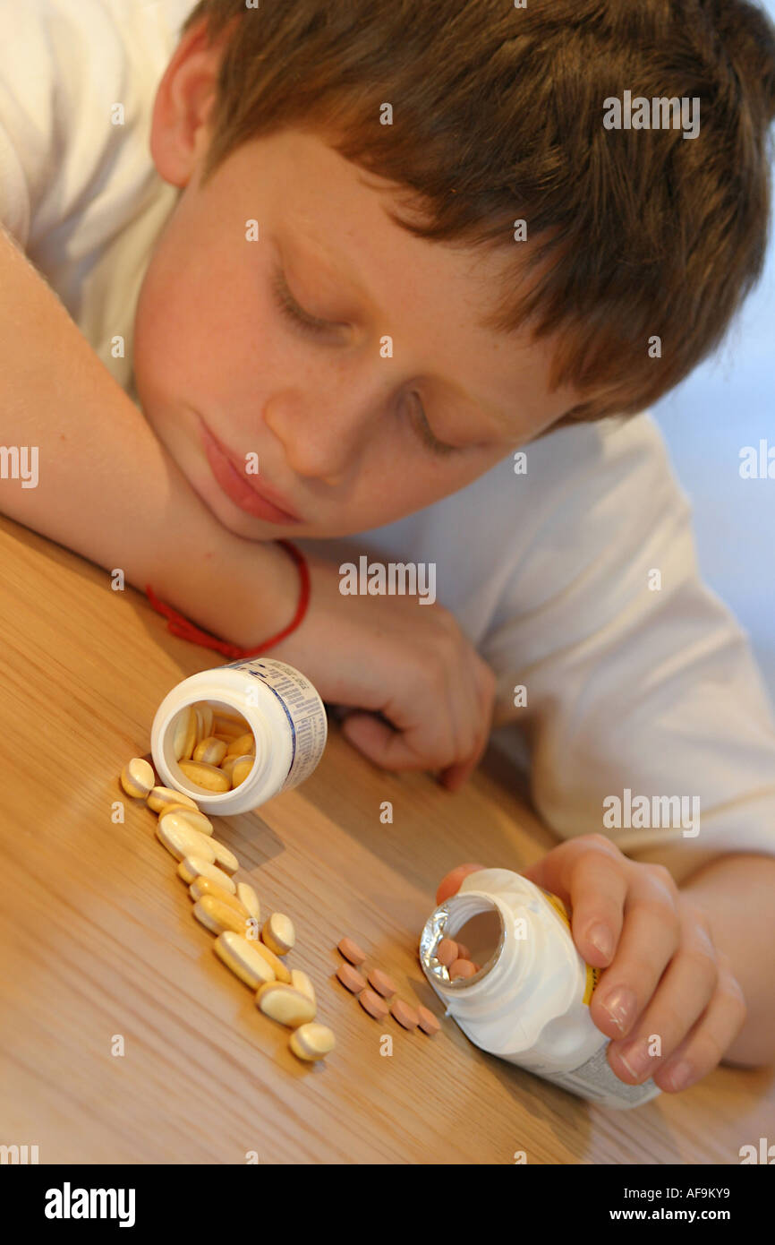 A Stock Photograph of a Yound Boy Depressed and Drugs Pouring out of a ...