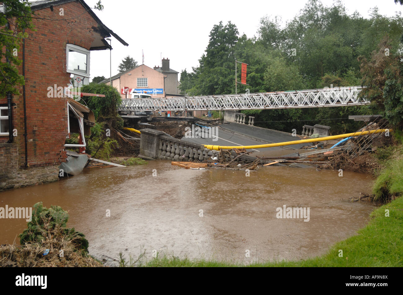 Road bridge and part of a house in Ludlow washed away by flooding of ...