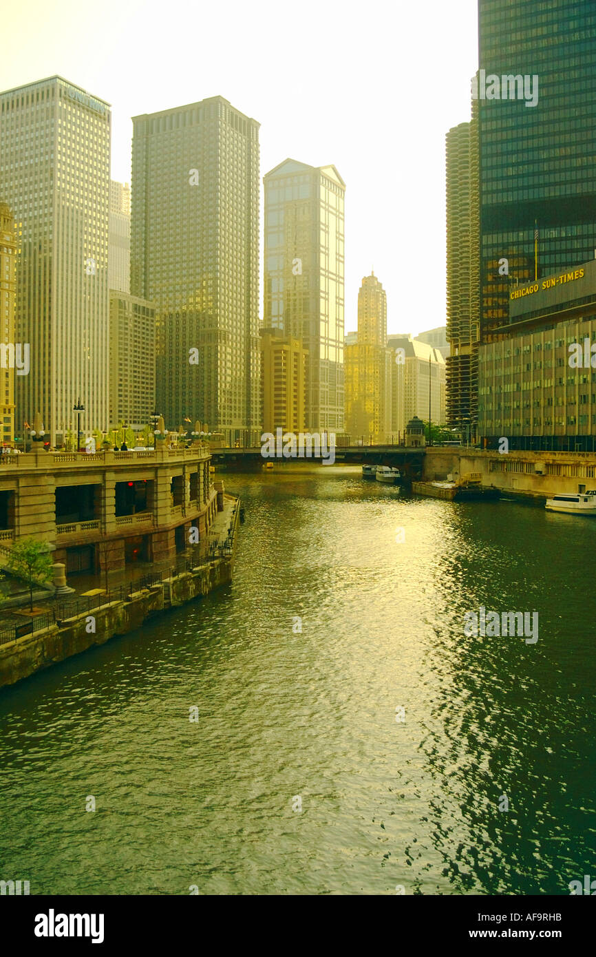 The downtown Chicago skyline seen over the Chicago river, late in the ...