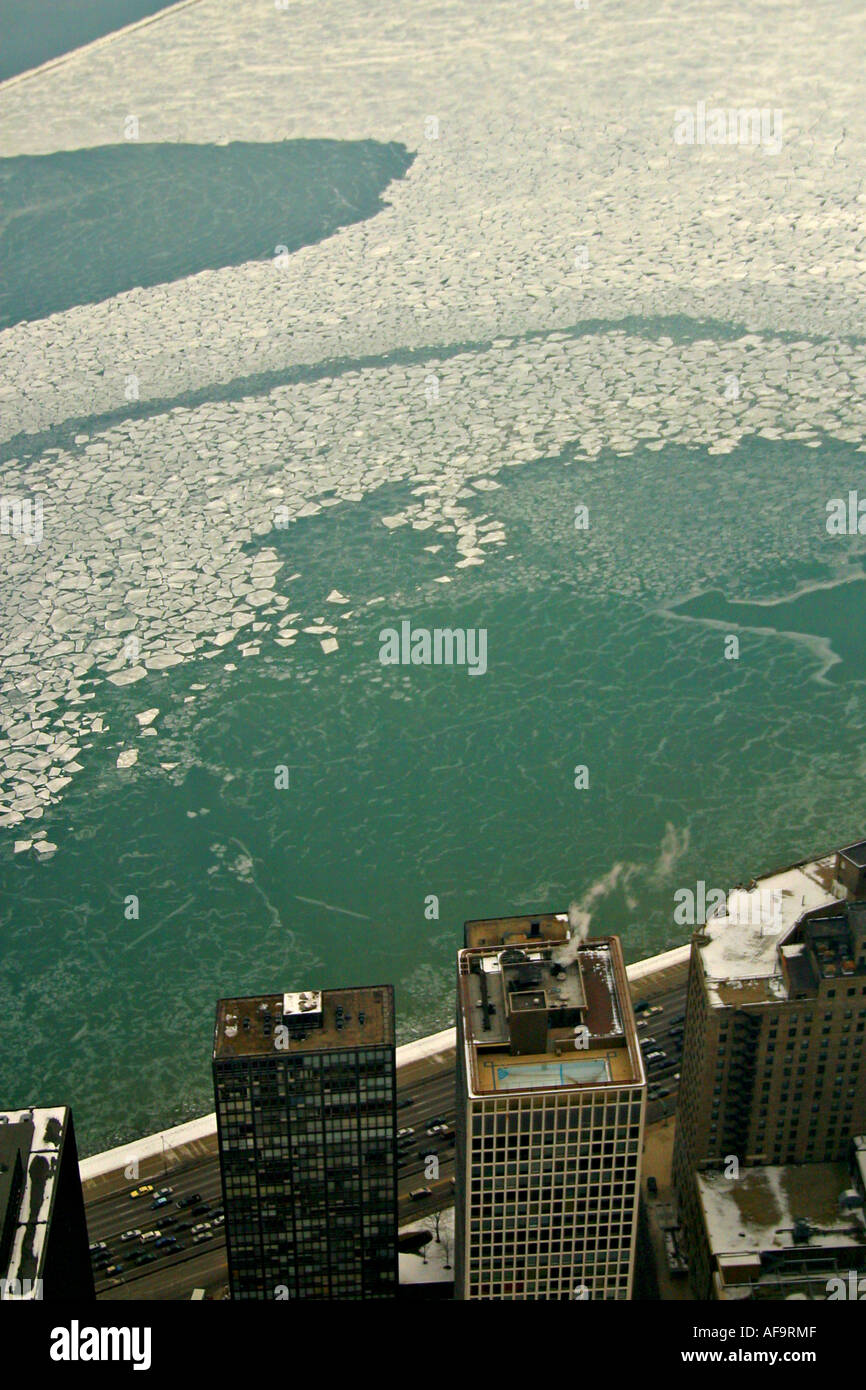 White ice on the cyan surface of Lake Michigan against the Chicago ...