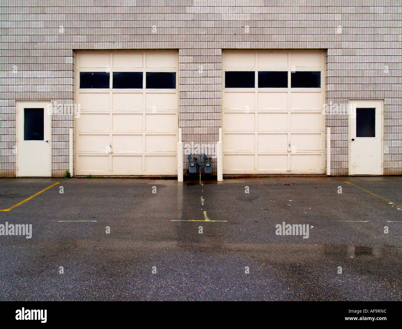 Two garage doors and two small doors in a mirrored formation Stock ...