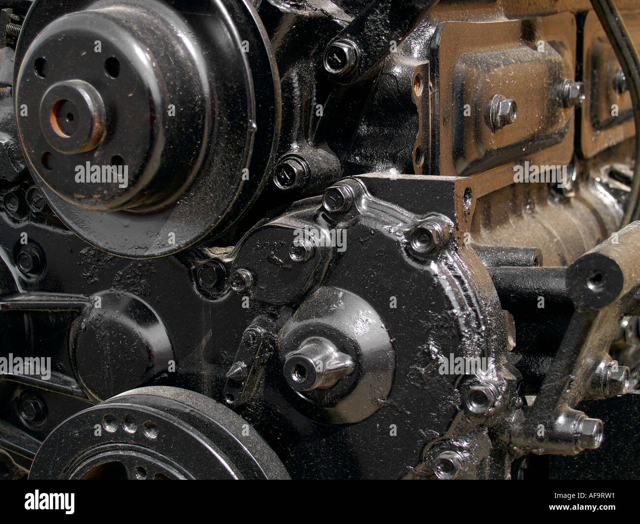 Close view of a large black industrial engine showing heavy block ...