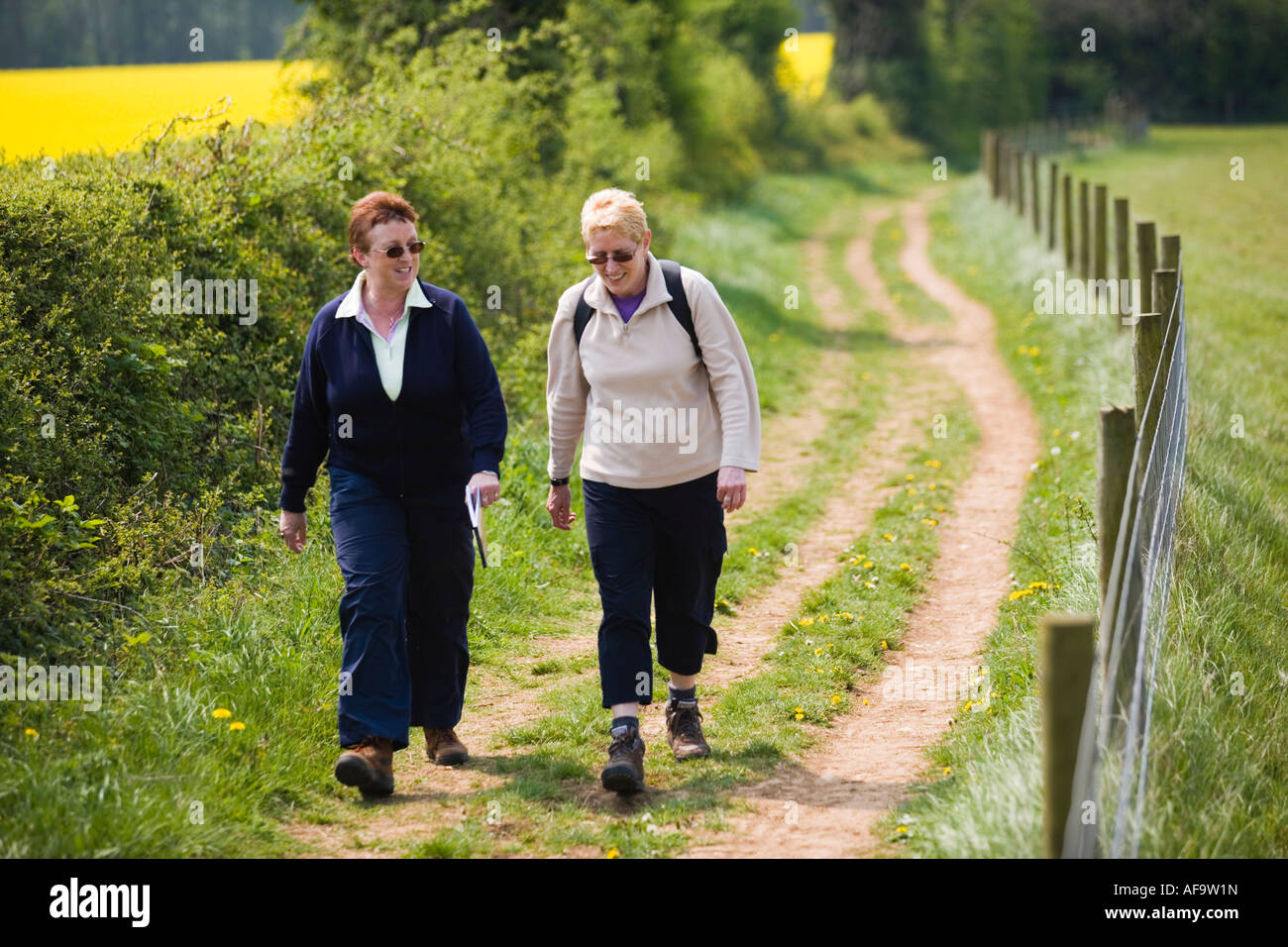 Middle aged couple on a walk in the countryside hi-res stock ...