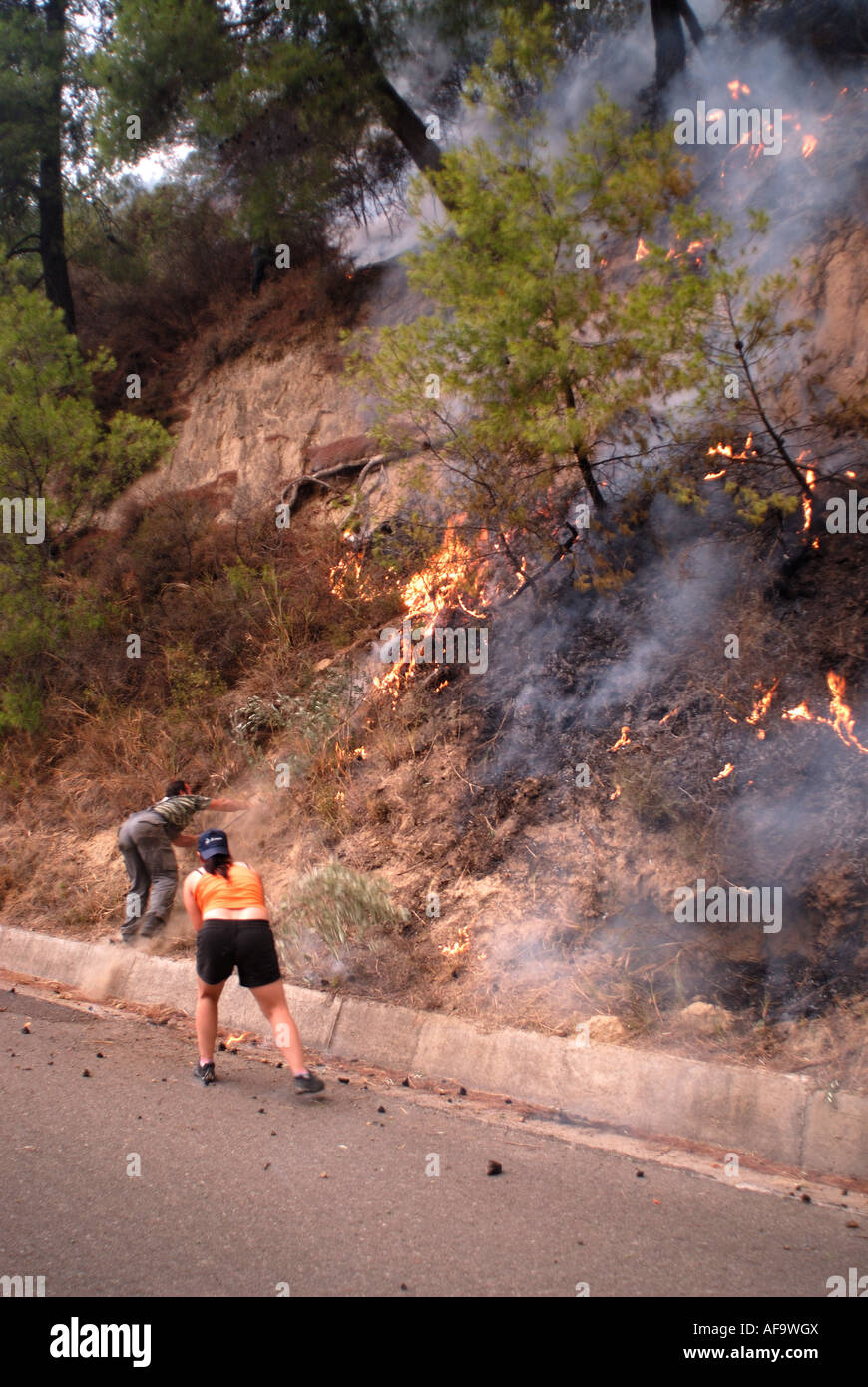 Trying to put out small fires hi-res stock photography and images - Alamy