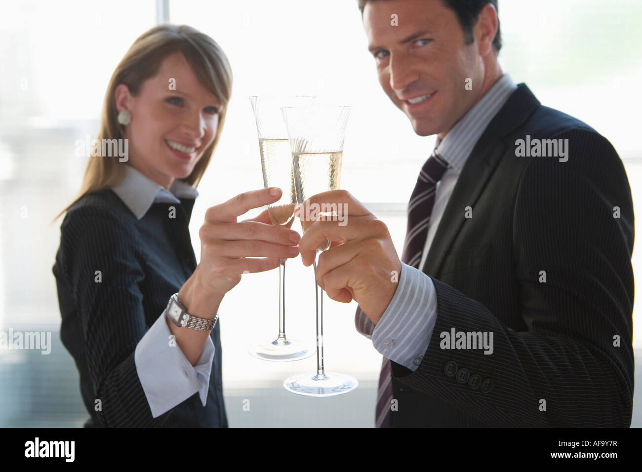 Business woman and business man toasting with sparkling wine Stock ...