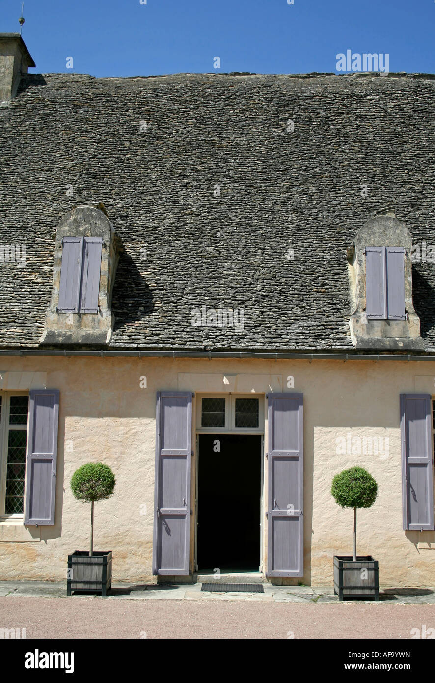 house front entrance with two standing shrubs in pots Stock Photo - Alamy