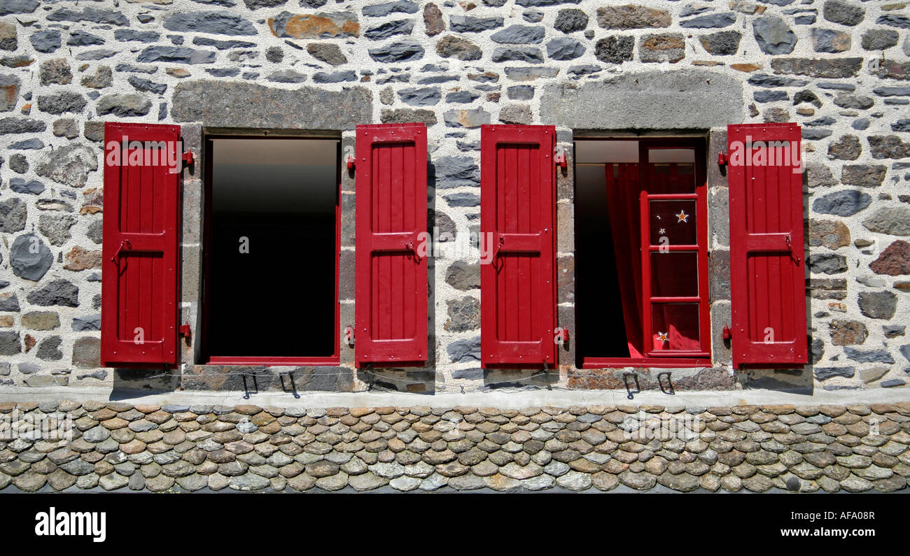 two windows with red shutters Stock Photo - Alamy