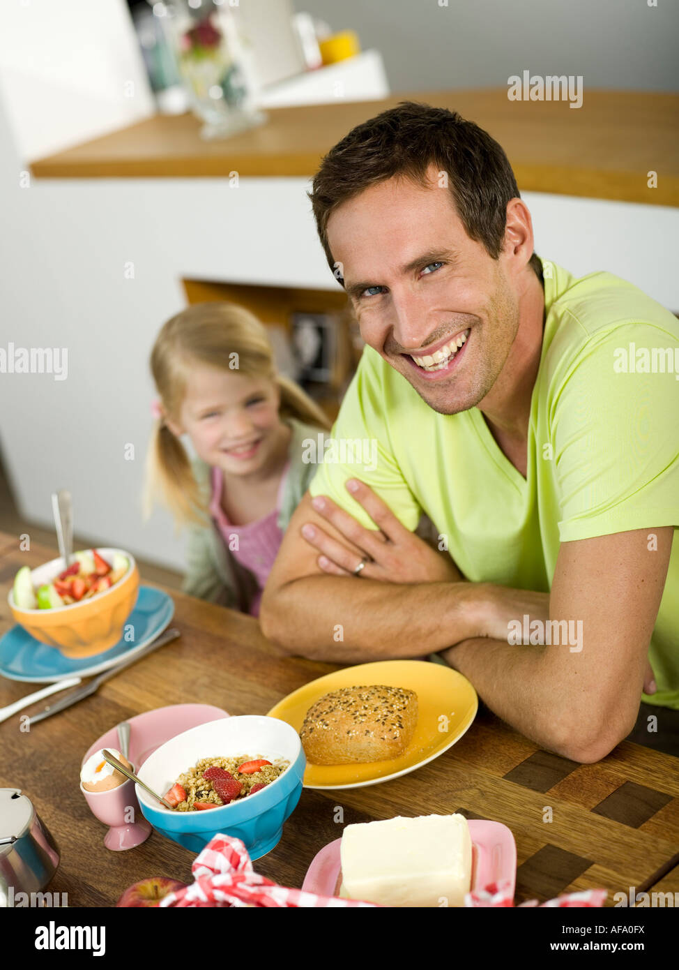Father and daughter at breakfast table Stock Photo - Alamy