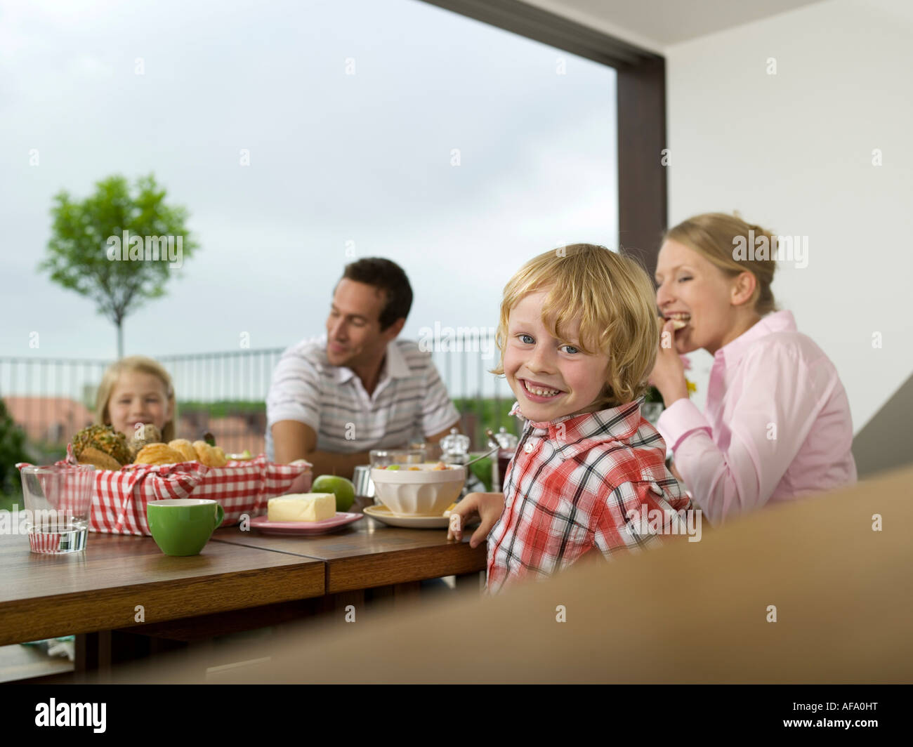 Family at breakfast table Stock Photo - Alamy