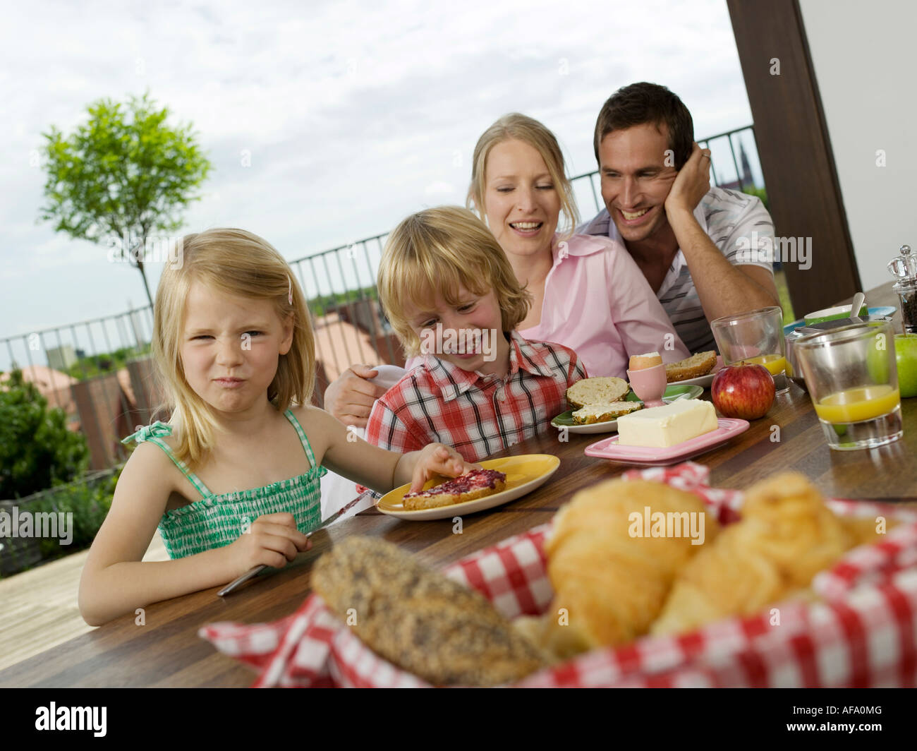 Family at breakfast table Stock Photo - Alamy