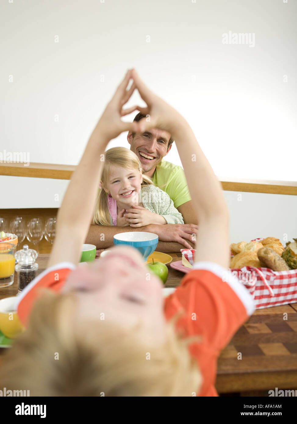 Father and children at breakfast table Stock Photo - Alamy
